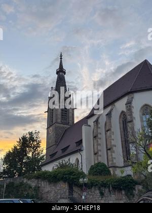 Gothic style church tower against clear blue sky, analog film ...