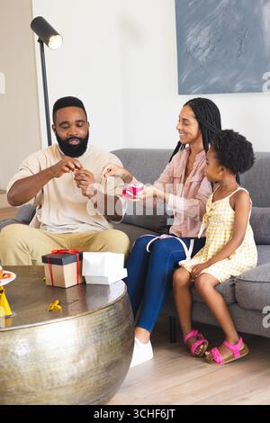 Happy family sharing gifts on the occasion of Diwali Stock Photo - Alamy