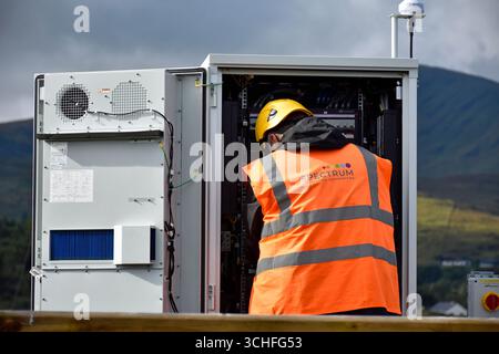 Engineers from Spectrum Communications Telecoms work on a telecom mast ...