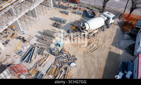 Above view on process of transshipment fresh concrete from mixer truck ...
