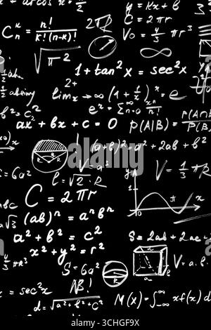 Handwritten scientific formulas and equations on a dark background ...