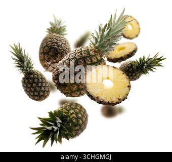 Ripe pineapples levitate on a white background Stock Photo - Alamy