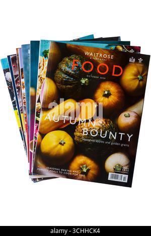 Pile of Waitrose & Partners Food magazine isolated on white background ...
