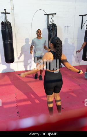 Red skipping rope on white background Stock Photo - Alamy