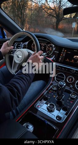 Driver's hands on a steering wheel of and car dashboard Stock Photo - Alamy