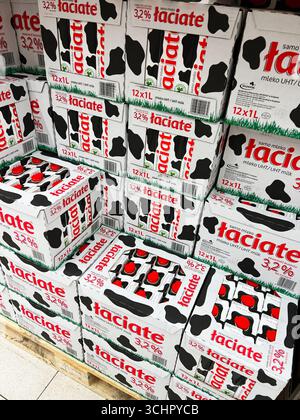 Cartons with milk packages displayed in grocery store from top view ...