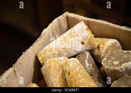 Organic panela blocks for sale at a stall in the San Juan market in ...