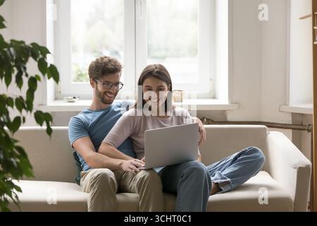 happy young family, couple buying new home with real estate agent ...