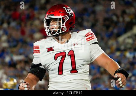 Utah offensive lineman Caleb Lomu blocks during an NCAA college ...