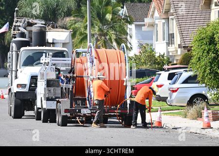 IRIVNE, CALIFORNIA - 09 SEPT 2025: Workers laying Fiber Optic Cable for ...