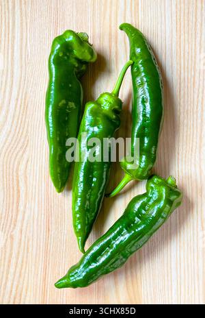 Four green peppers Stock Photo - Alamy