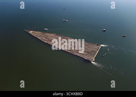 Forestry workers float a raft of felled tree trunks from the Bergmatt ...