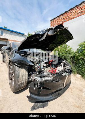 Accident damage to a TESLA electric car, damage to the front part ...