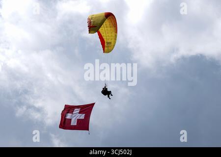 Paragliding tandem flight with Swiss flag, Interlaken, Switzerland ...