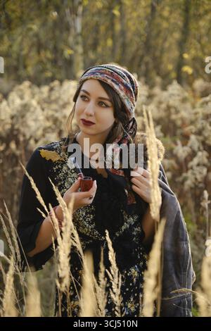 Ginger young woman looking aside and showing stop gesture isolated over ...