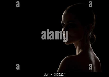 beautiful woman profile silhouette on back background with copy space ...