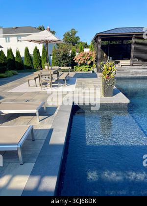 Modern luxury backyard pool, sundeck, dining set, garden fire pit, hot ...