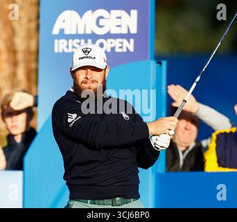 Tyrrell Hatton, of England, watches his tee shot on the second hole ...