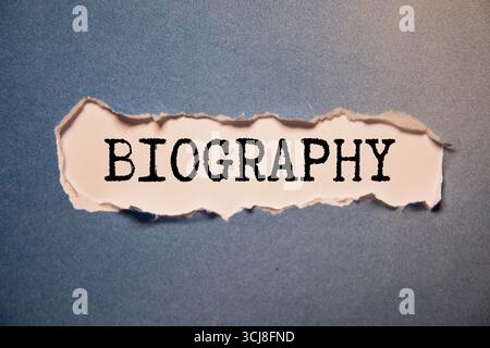 Biography On blackboard with cup of coffee, with glasses on wooden ...