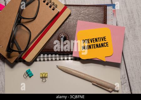 Preventive Maintenance text written on paper with magnifying glass ...