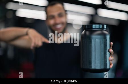 Black Sporty Male Demonstrating Blank Container For Whey Protein Powder ...