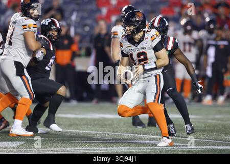 B.C. Lions quarterback Nathan Rourke (12) and offensive lineman Michael ...