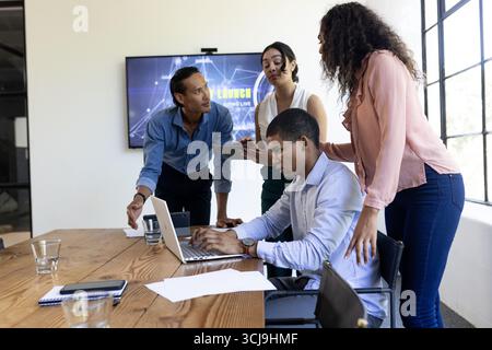 Asian business team collaborating on UI UX design creative process in ...