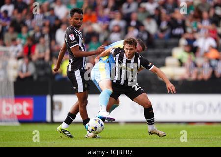 Nicholas Tsaroulla of Notts County battles with Armando Dobra of ...