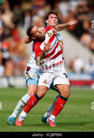 Doncaster Rovers' Billy Sharp (left) and Birmingham City's Paul ...