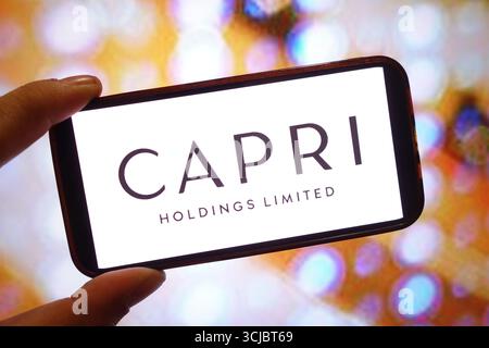 In this photo illustration, Capri Holdings Limited logo seen displayed ...
