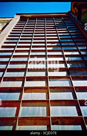 Sunlit interior courtyard (lightwell) of a 1960s residential building ...