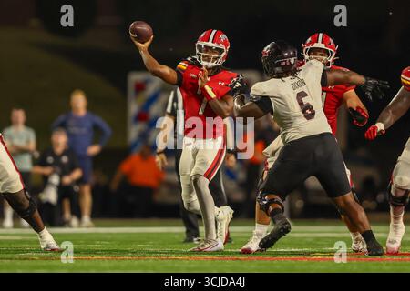 Maryland quarterback Malik Washington throws during the first half of ...