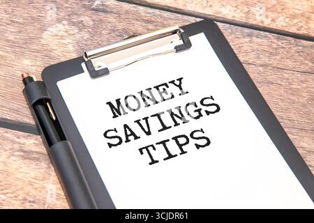 Money Saving Tips text messege and piggy bank on pink background Stock ...