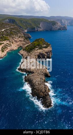 Panoramic view of sea beach with splashing waves against dramatic ...