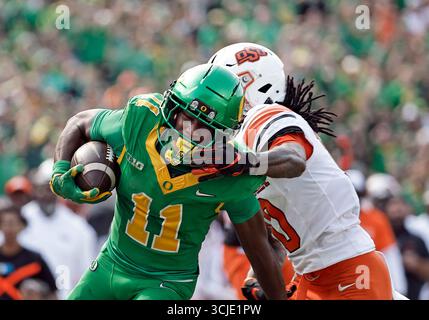Oregon wide receiver Jeremiah McClellan (11) is tackled by Rutgers ...