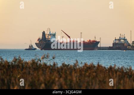 Oil tanker moored at industrial port digital artwork Stock Photo - Alamy