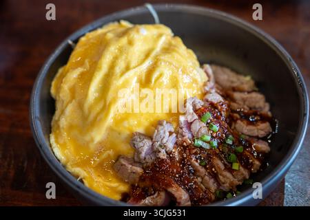 Omelet with cheese served on white plate Stock Photo - Alamy