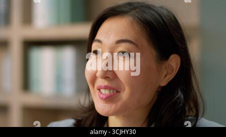 Cheerful korean lady freelancer working from home Stock Photo - Alamy