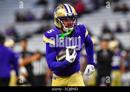 Washington wide receiver Omari Evans (5) is tackled by Ohio State ...