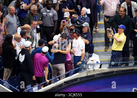 Jannik Sinner of Italy embraces Carlos Alcaraz at the end of the final ...