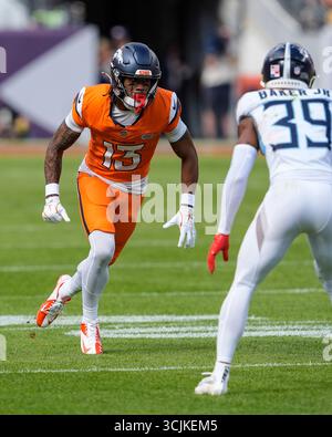 Denver Broncos wide receiver Pat Bryant (13) runs onto the field in the ...