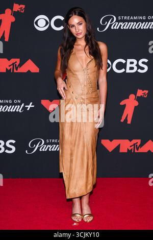 Ashtin Earle walking on the red carpet at the 2025 CFDA Fashion Awards ...