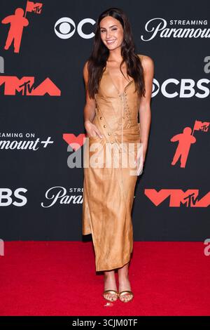 Ashtin Earle walking on the red carpet at the 2025 CFDA Fashion Awards ...