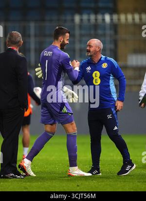 Scotland manager Steve Clarke greets George Hirst as he is substituted ...