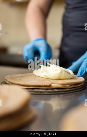 Cooking buttery cream on kitchen Stock Photo - Alamy