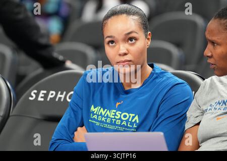 Minnesota Lynx assistant coach Rebekkah Brunson, center, and coach Eric ...