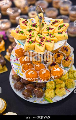Indian assorted Diwali sweets or mithai with diya and flowers. Festive ...