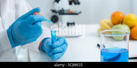Scientist check chemical food residues in laboratory. Control experts ...