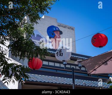 Los Angeles Dodgers' Shohei Ohtani, right, heads to first for a single ...