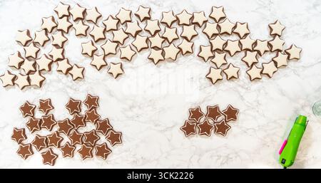 Perfectly Icing Star Cookies with Royal Icing Stock Photo - Alamy